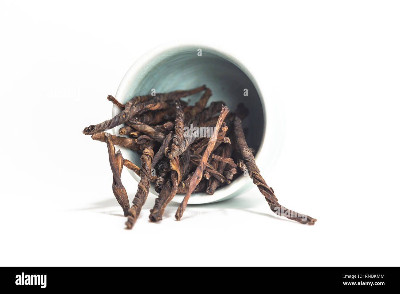 Dried chinese tea leave on white background Stock Photo - Alamy