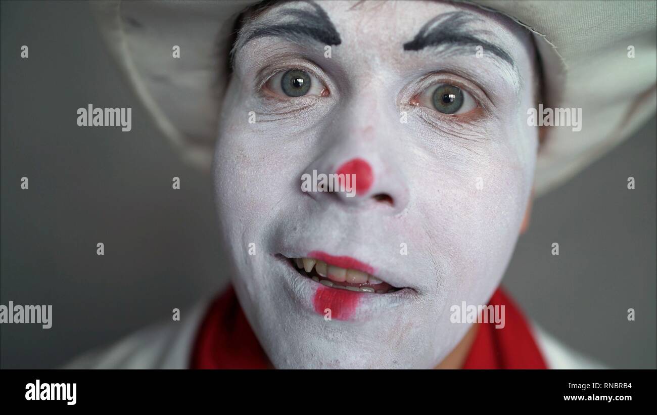 Very cute pantomime close up. Closeup portrait of a cute guy. A ...