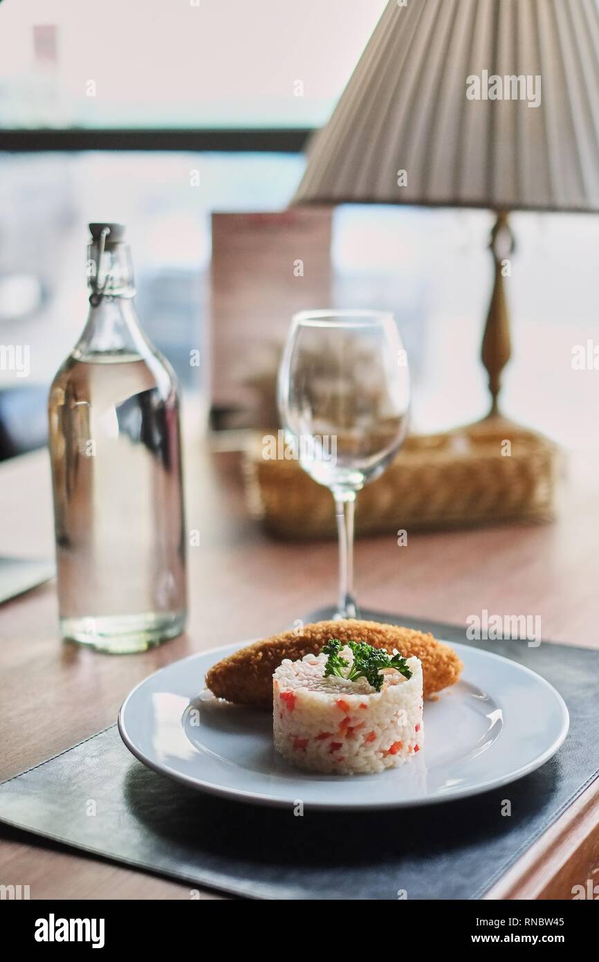 dish with rice and chop fried in the restaurant. Funny Italian risotto ...
