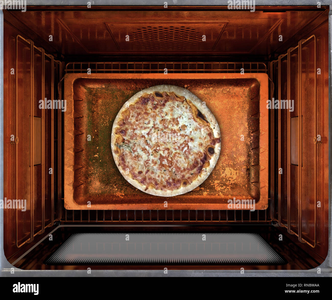 A cross section top view from above a hot operational household oven ...