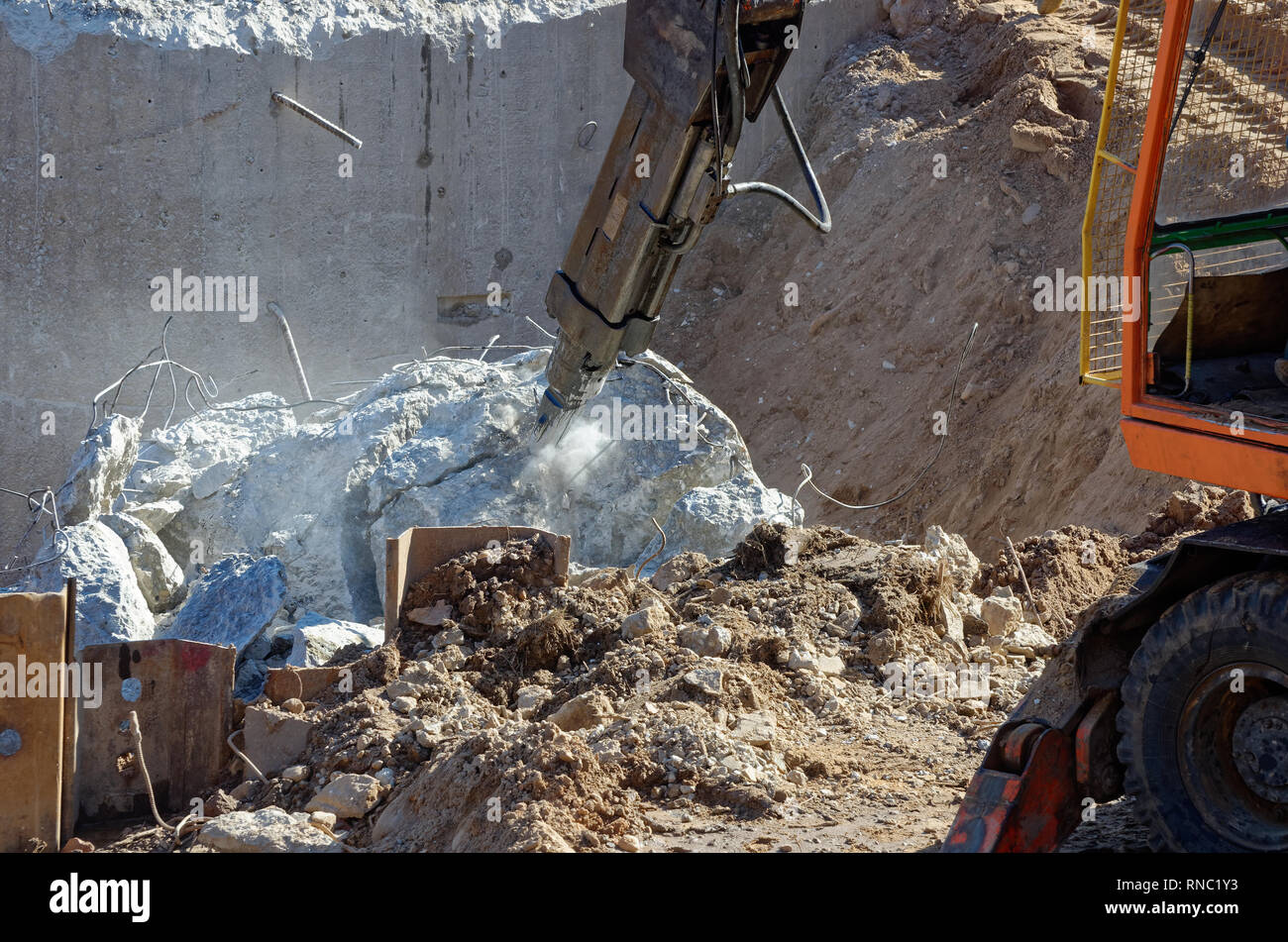 Hand of old Demolition Excavator with hydraulic hammer at process of ...