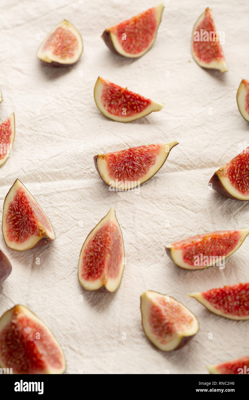 Raw figs slices background Stock Photo - Alamy