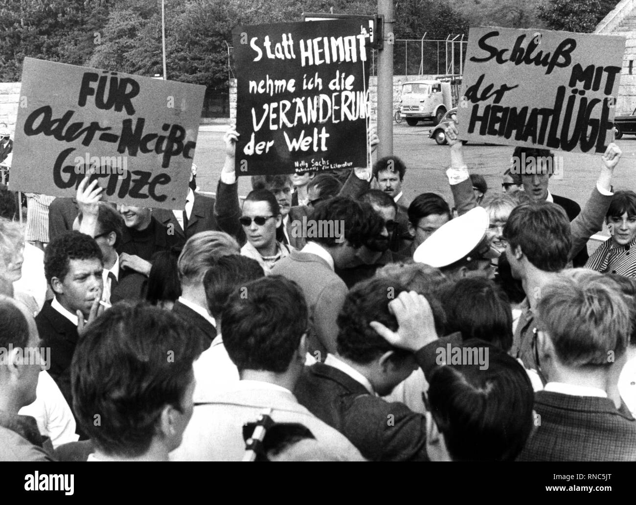 Demonstrators with signs in front of the entrance to the Waldbühne. On ...