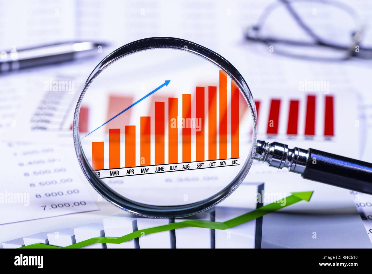 Magnifying glass with charts, tables and pen | usage worldwide Stock ...