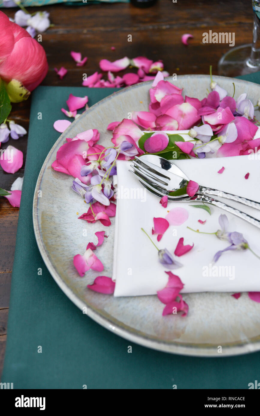 A beautiful outdoor table display, with lots of Spring flowers in ...