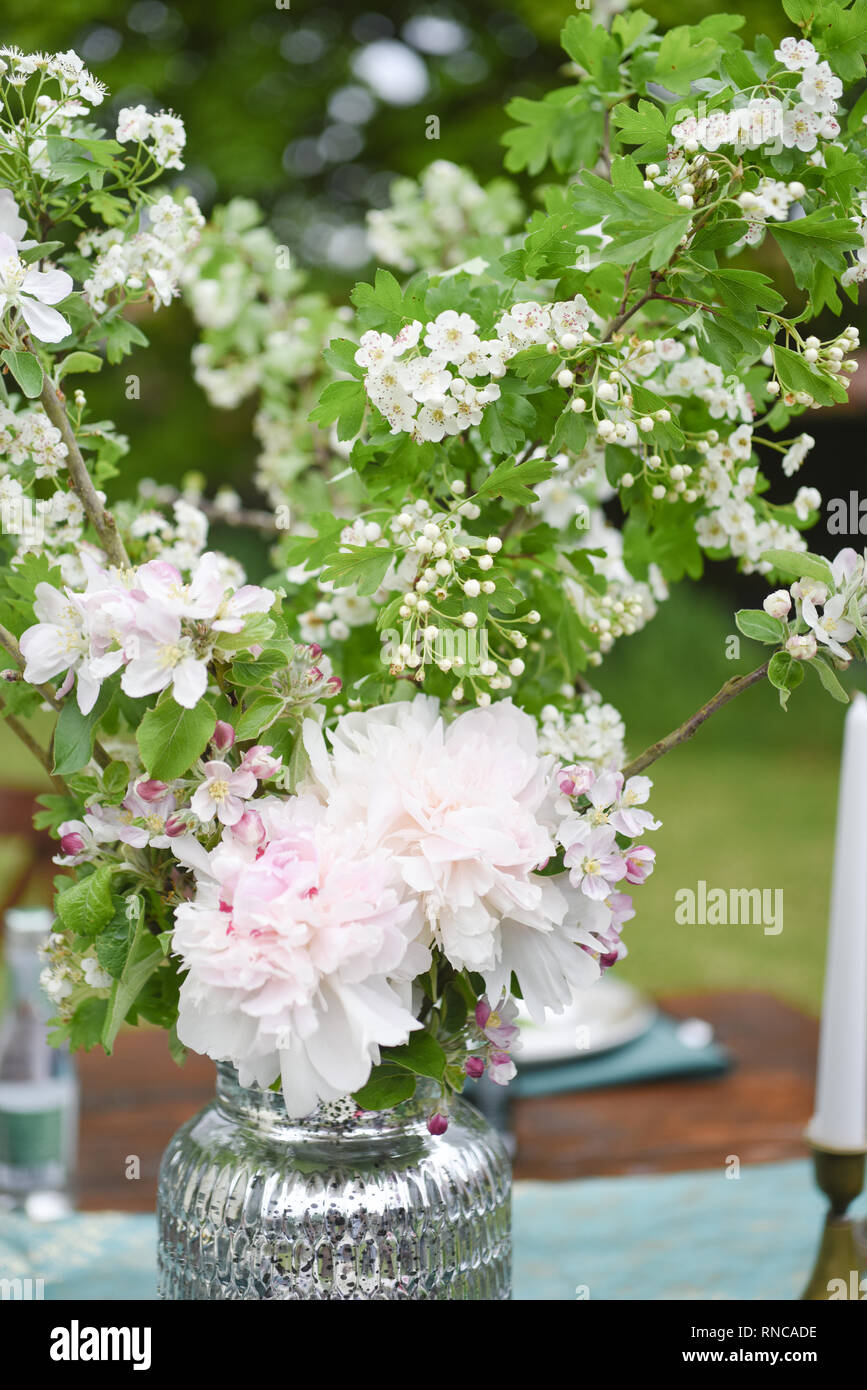 A beautiful outdoor table display, with lots of Spring flowers in ...