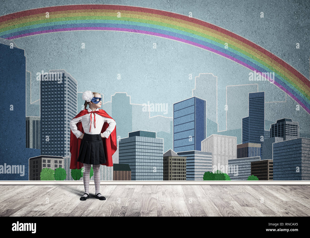 Girl power concept with cute kid guardian against drawn cityscape ...