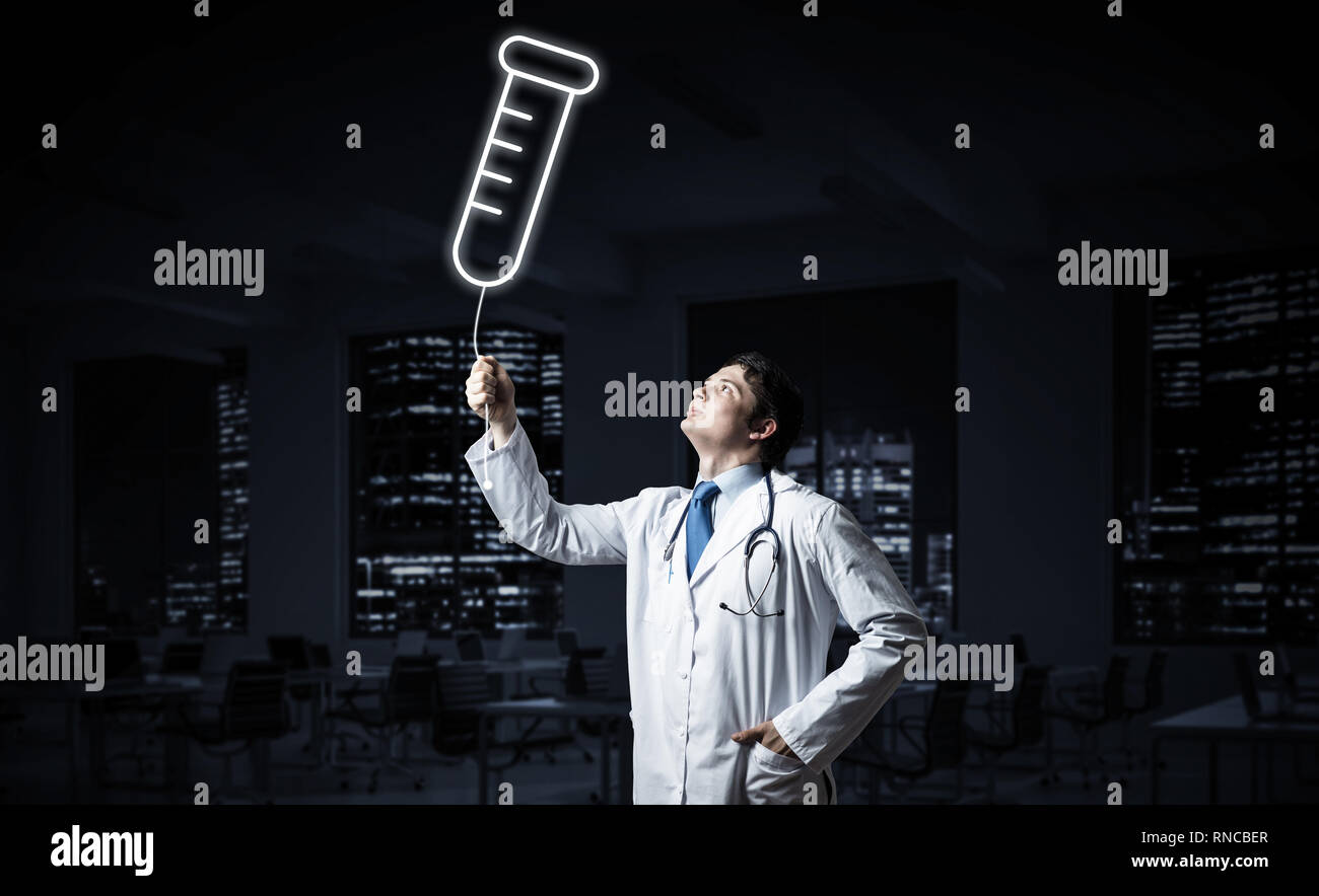 Doctor and medical vial symbol Stock Photo - Alamy