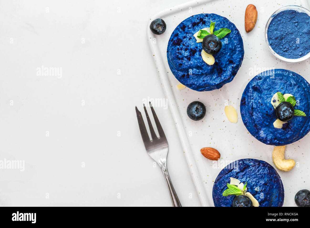blueberry and butterfly pea flower tea vegan cashew cakes with fresh ...
