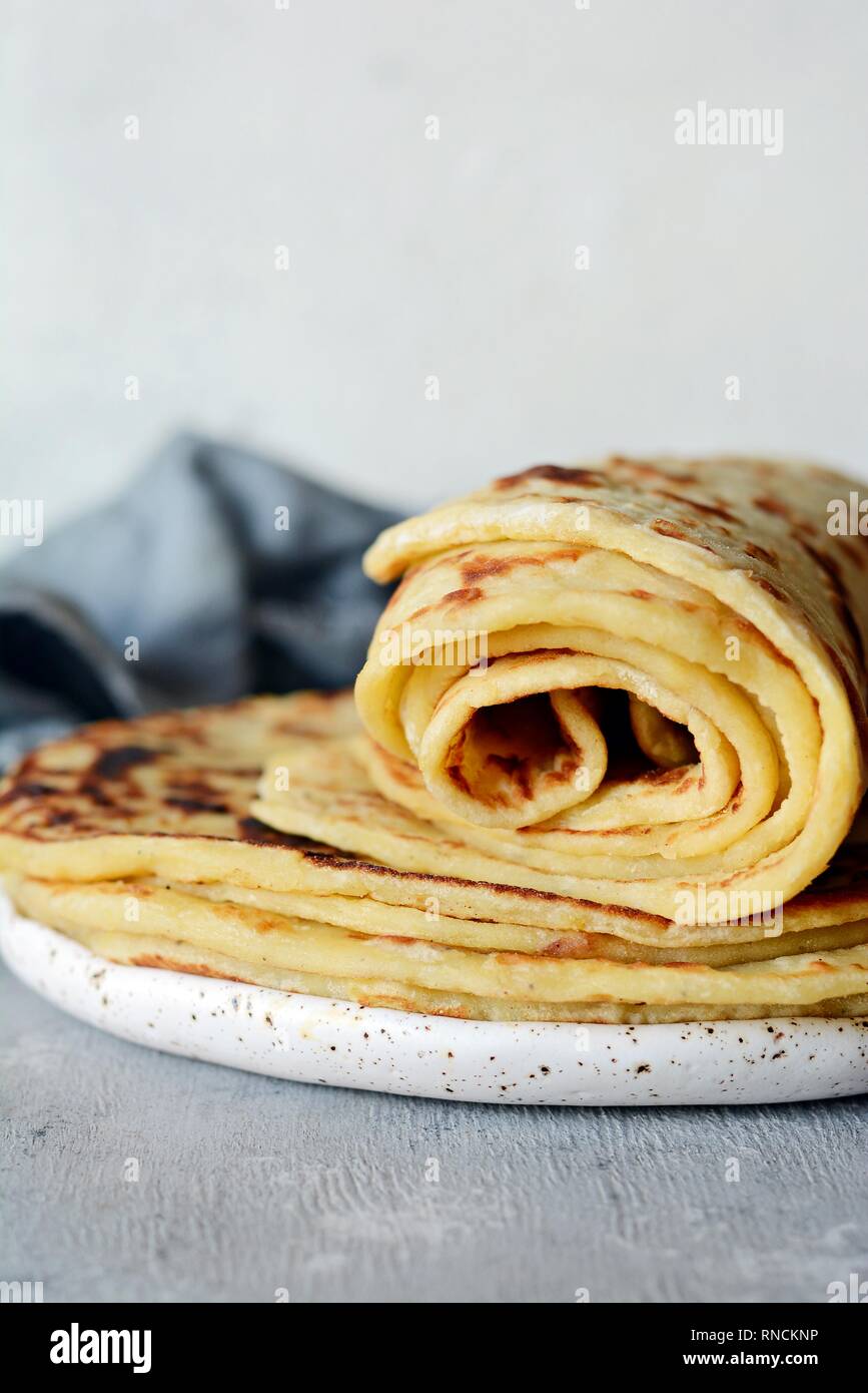 Norwegian potato pancakes Lefse on a light background with cheese and ...