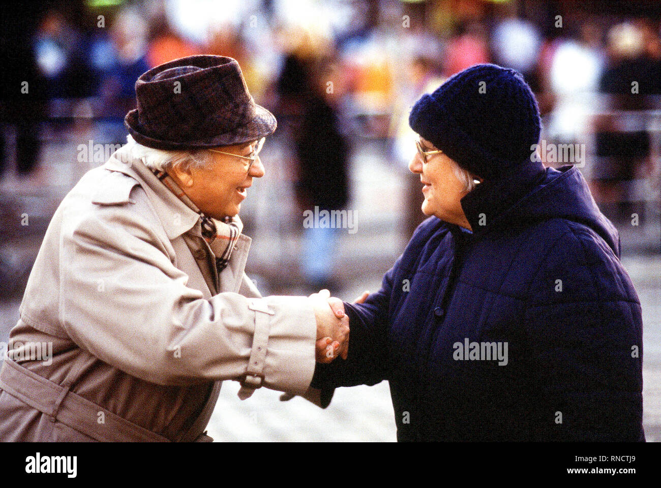 Friends greet each other on the Ku'damm in West Germany Stock Photo - Alamy