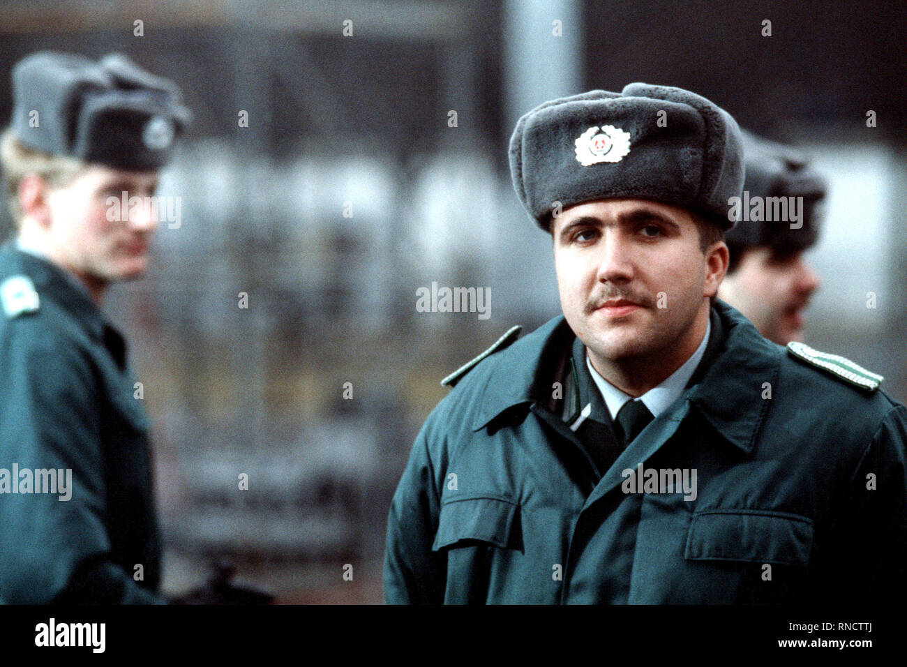 An East German guard observes activities prior to the official opening ...