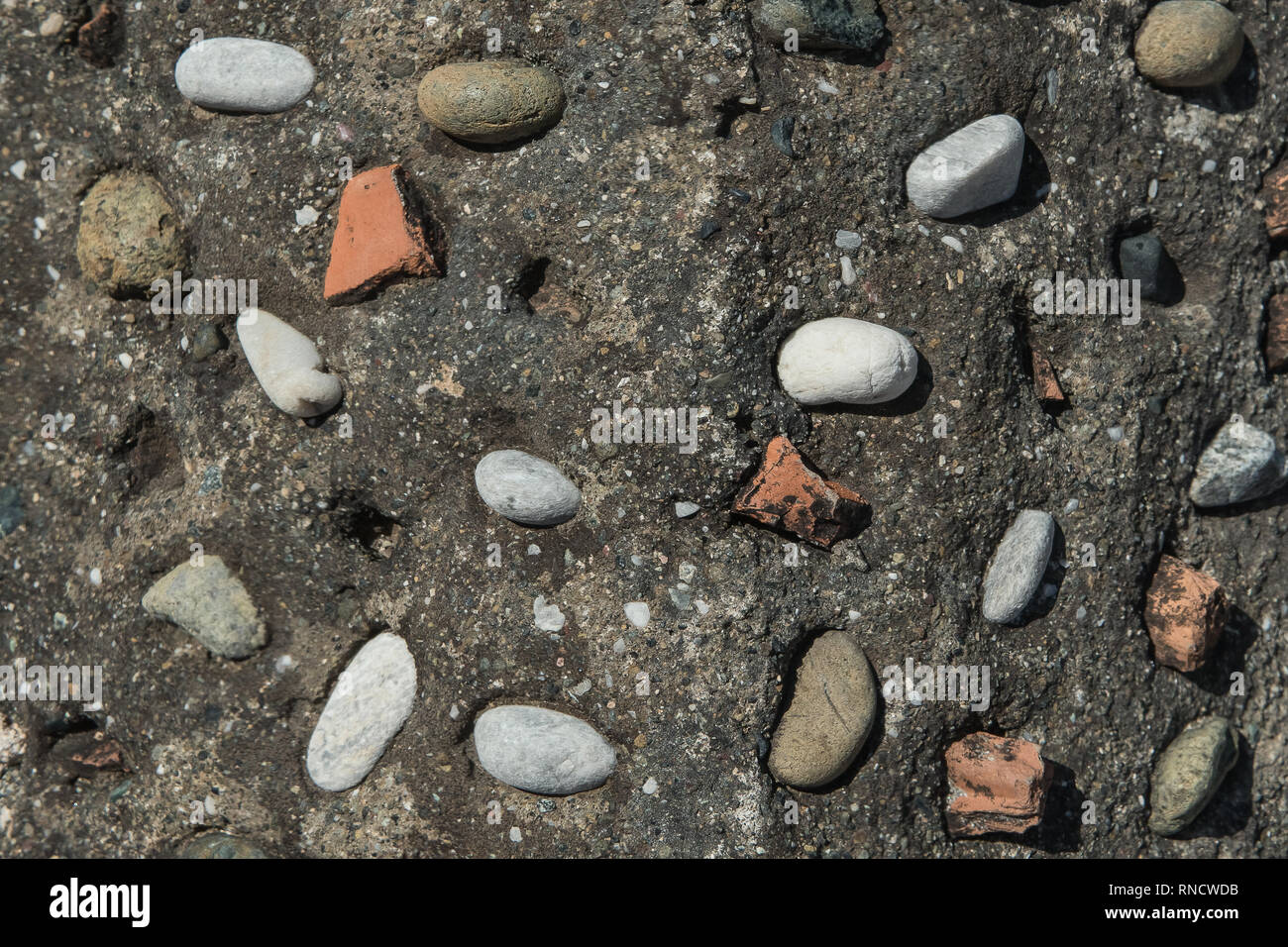 Cobblestone texture, stone wallpaper closeup. Rock wall background ...