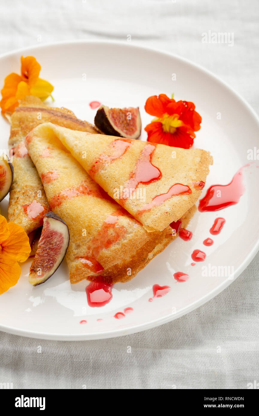 Breakfast crepes with sauce on plate Stock Photo - Alamy