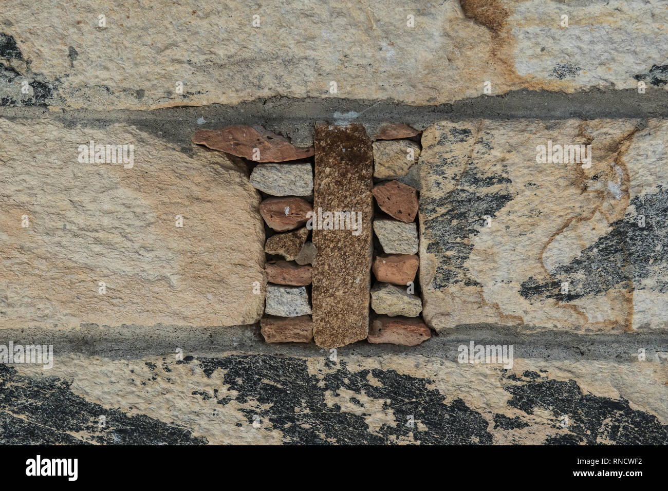 Aged stone, old bricks texture, rocky wall surface closeup. Grunge rock ...