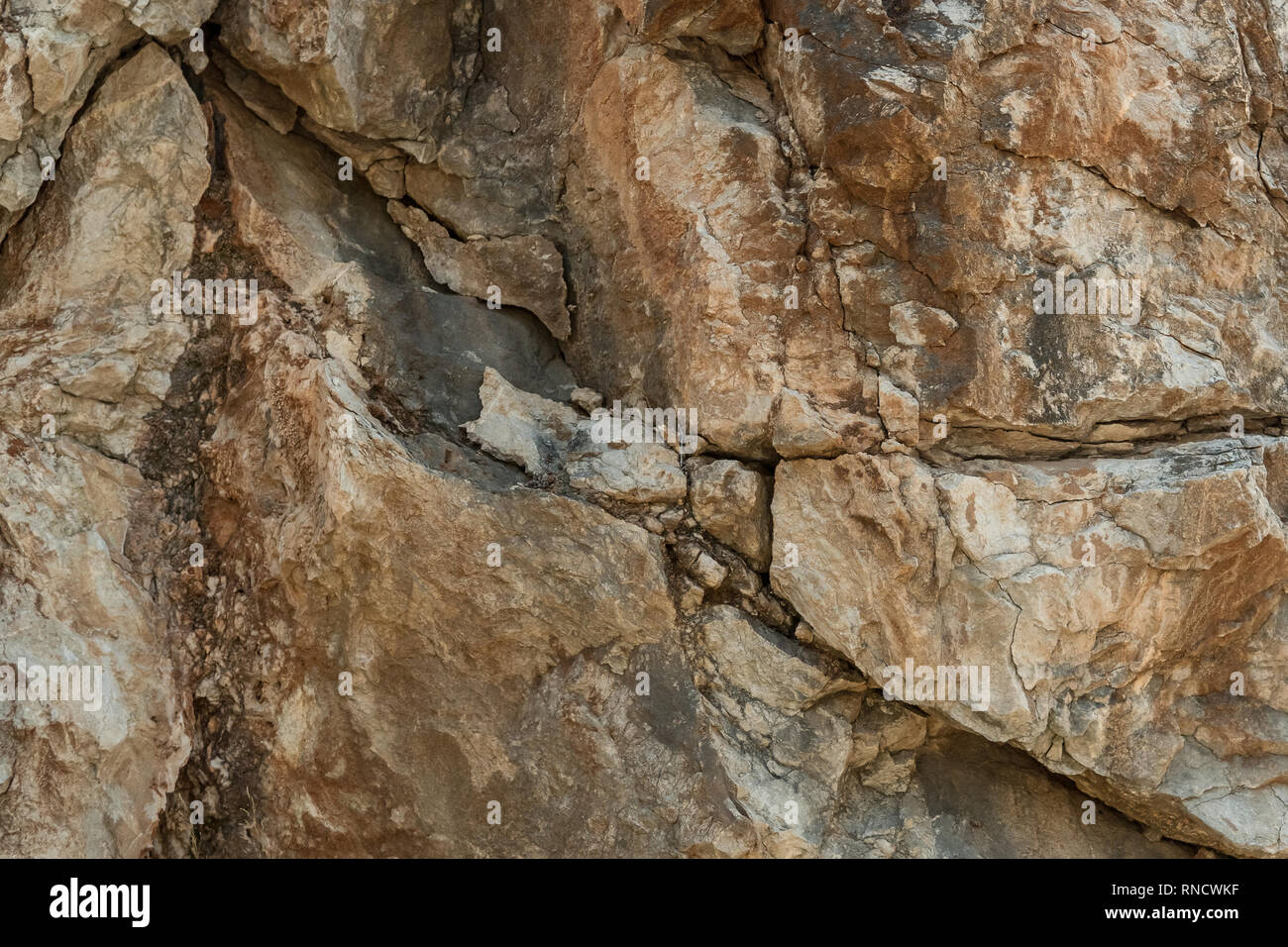 Stone with faults texture, surface closeup. Rock wall background ...
