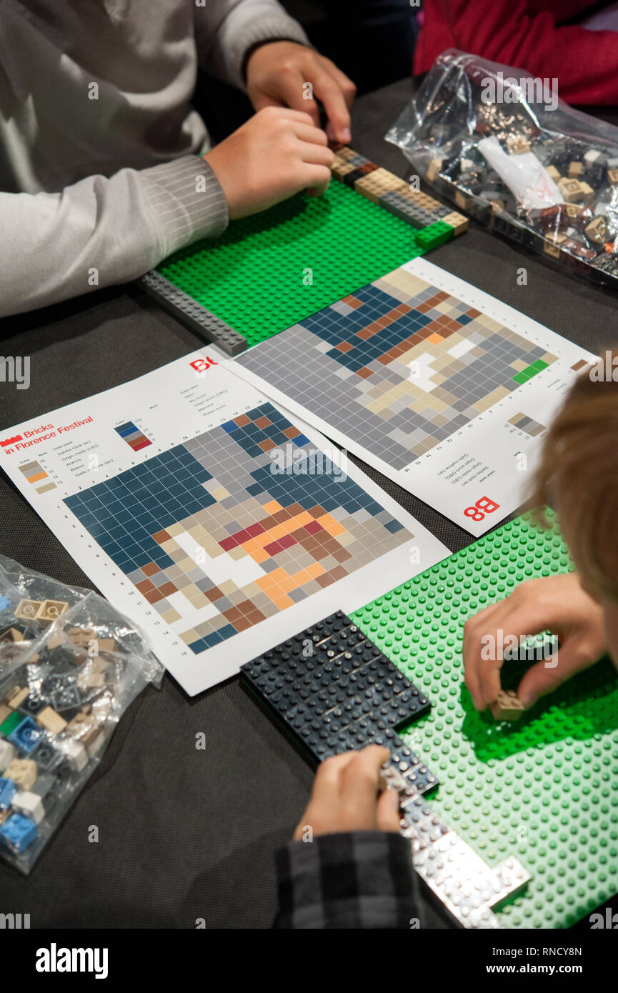 Florence, Italy - November 11, 2017: kids build a Lego bricks mosaic ...