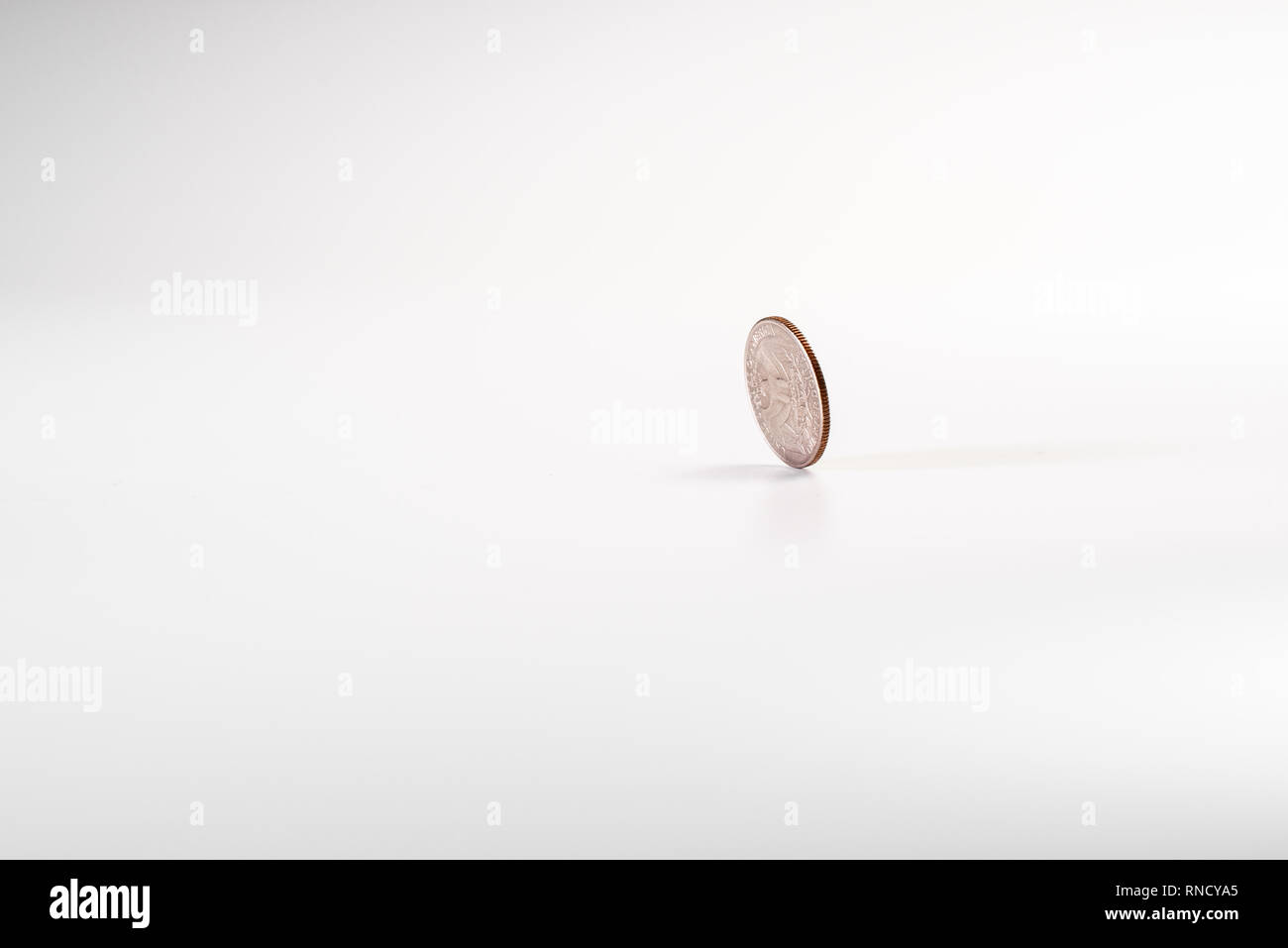 Dollar coin rotating on white background, concept of American economy ...