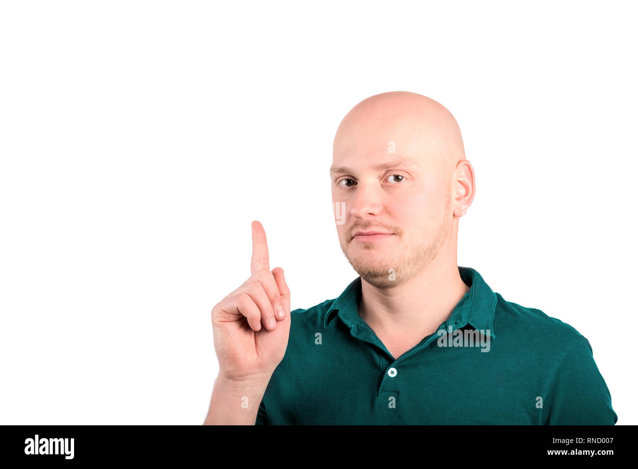Young man pointing finger up and having an idea Stock Photo - Alamy