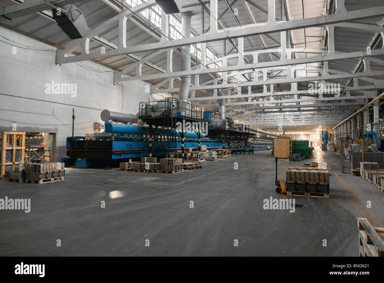 Workers perform their tasks in the shop production plant Stock Photo ...