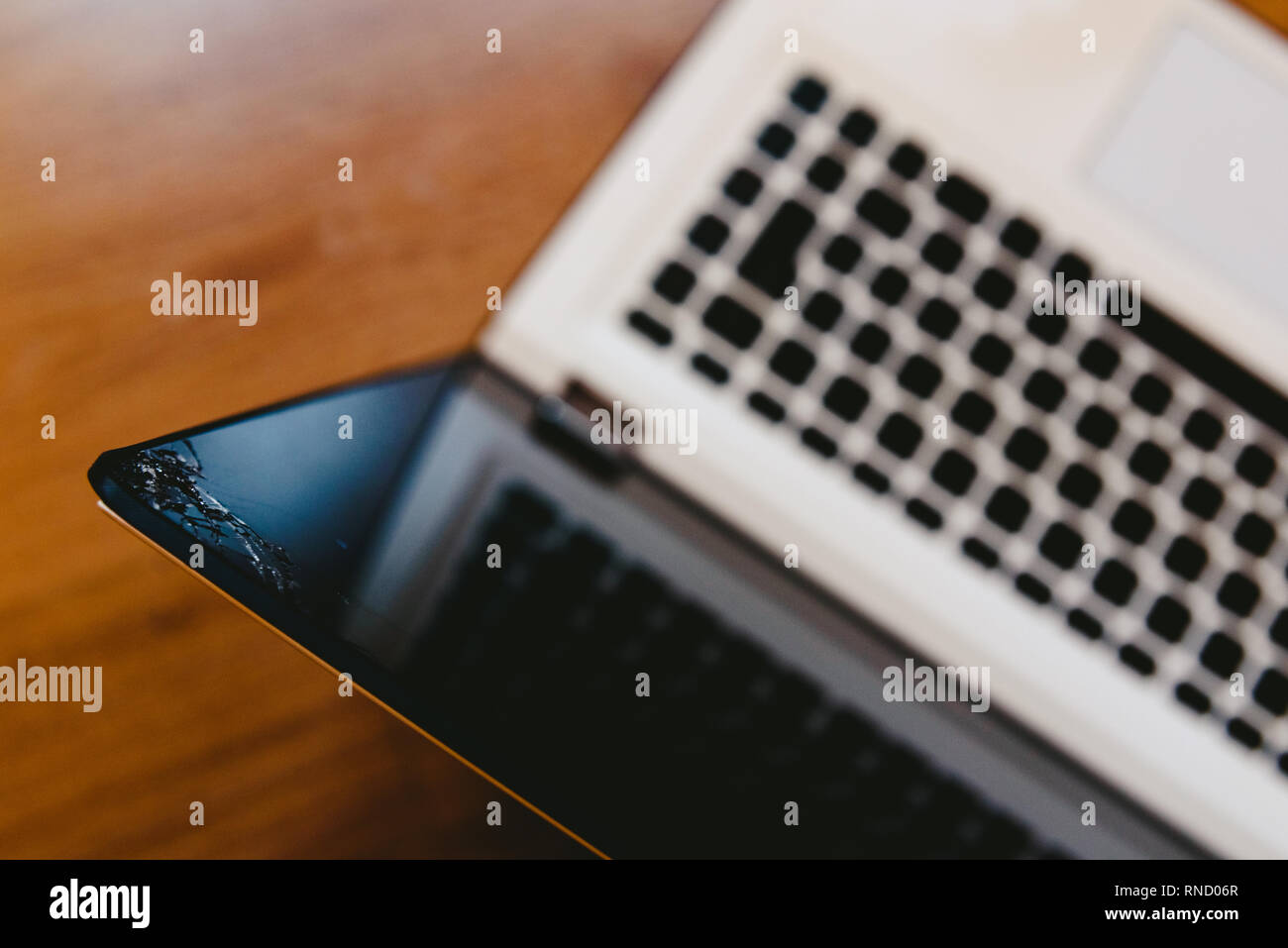 Laptop computer screen with broken glass by accident Stock Photo - Alamy