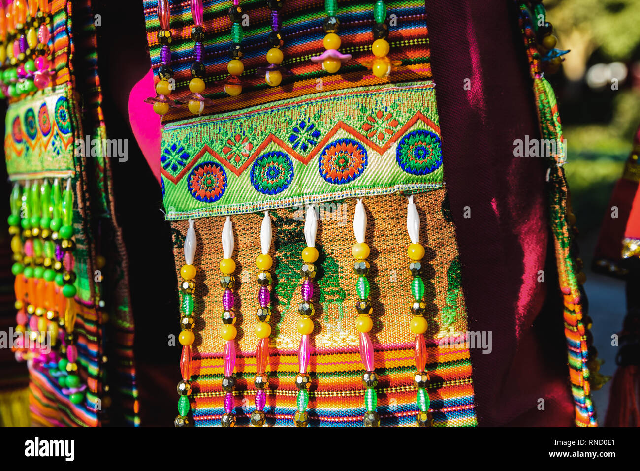 Detail of the colorful embroidery of a typical costume from the Andean ...