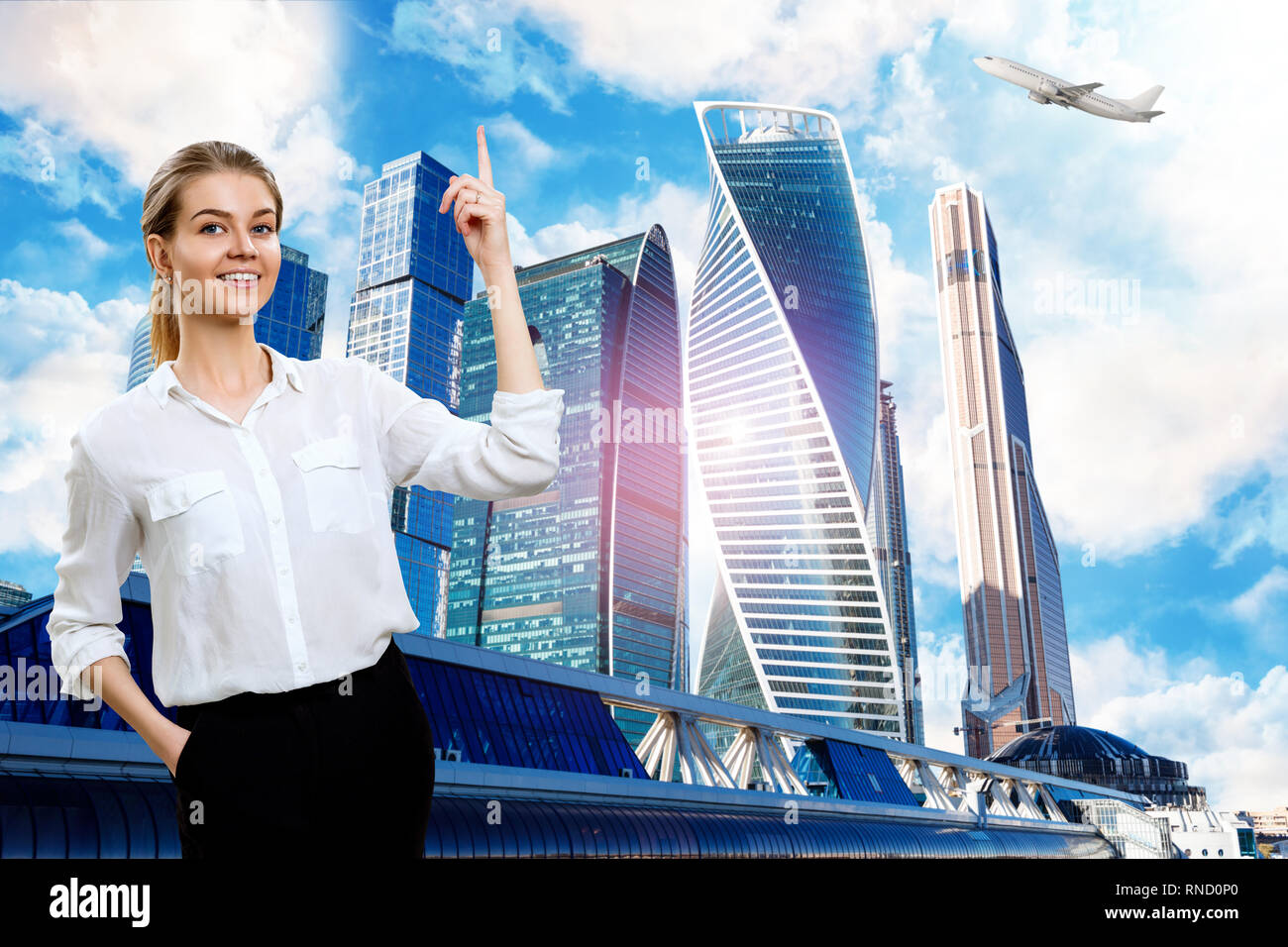 Young business woman raises forefinger up Stock Photo - Alamy