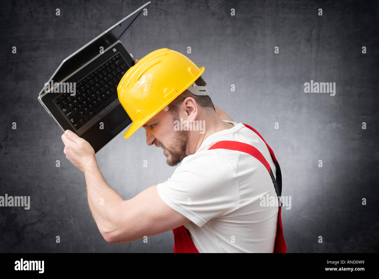 Construction worker with laptop Stock Photo - Alamy