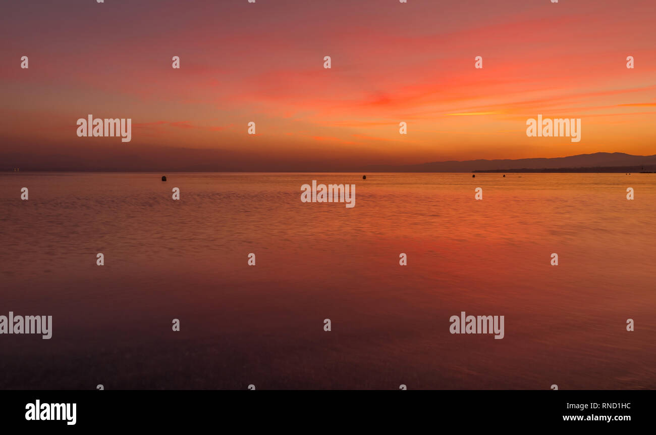 Beautiful colorful sunset sky with clouds over the lake Leman. Lausanne ...