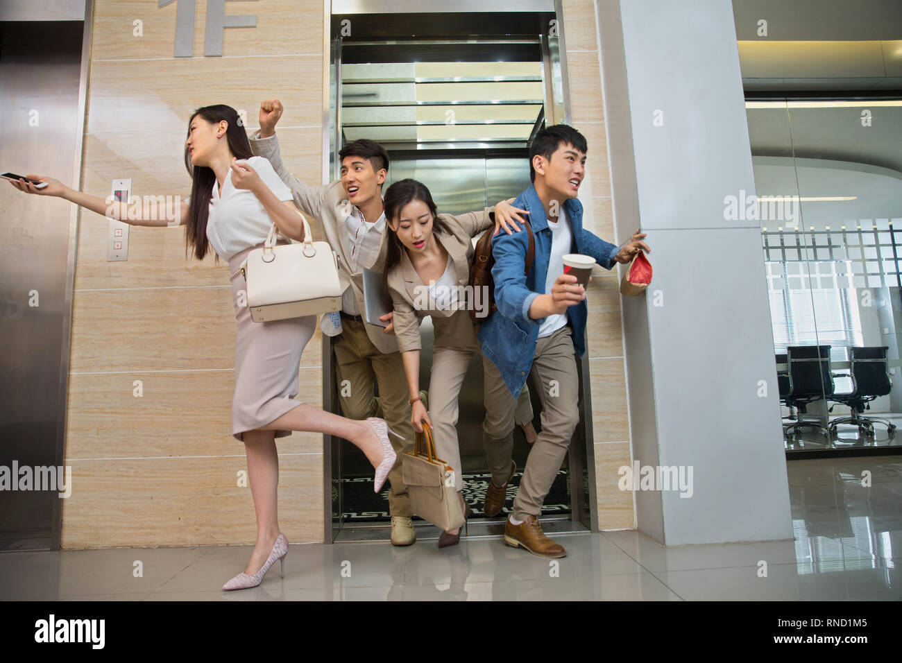 Business men and women crowded elevators Stock Photo - Alamy