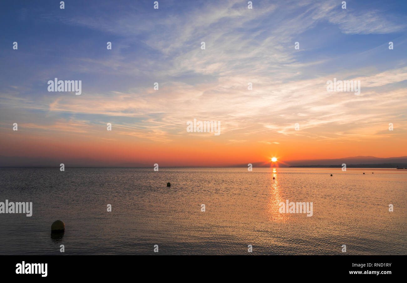 Beautiful colorful sunset sky with clouds over the lake Leman. Lausanne ...