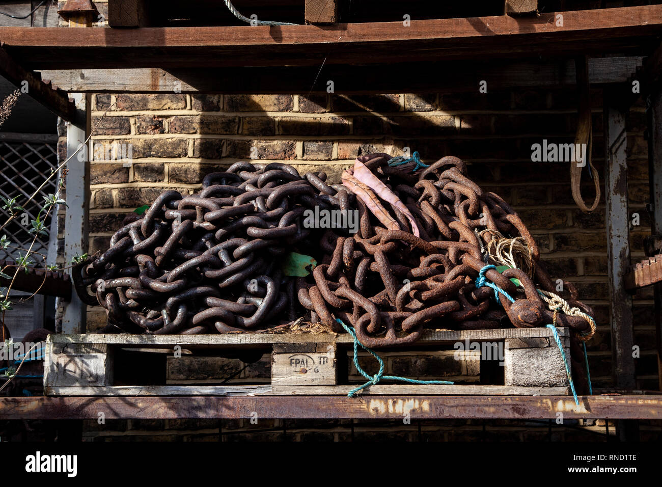 Heavy chains on a metal rack Stock Photo - Alamy