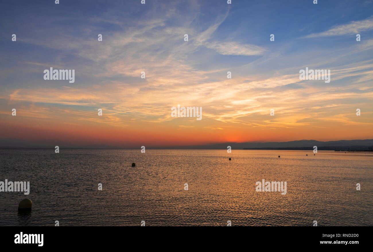 Beautiful colorful sunset sky with clouds over the lake Leman. Lausanne ...