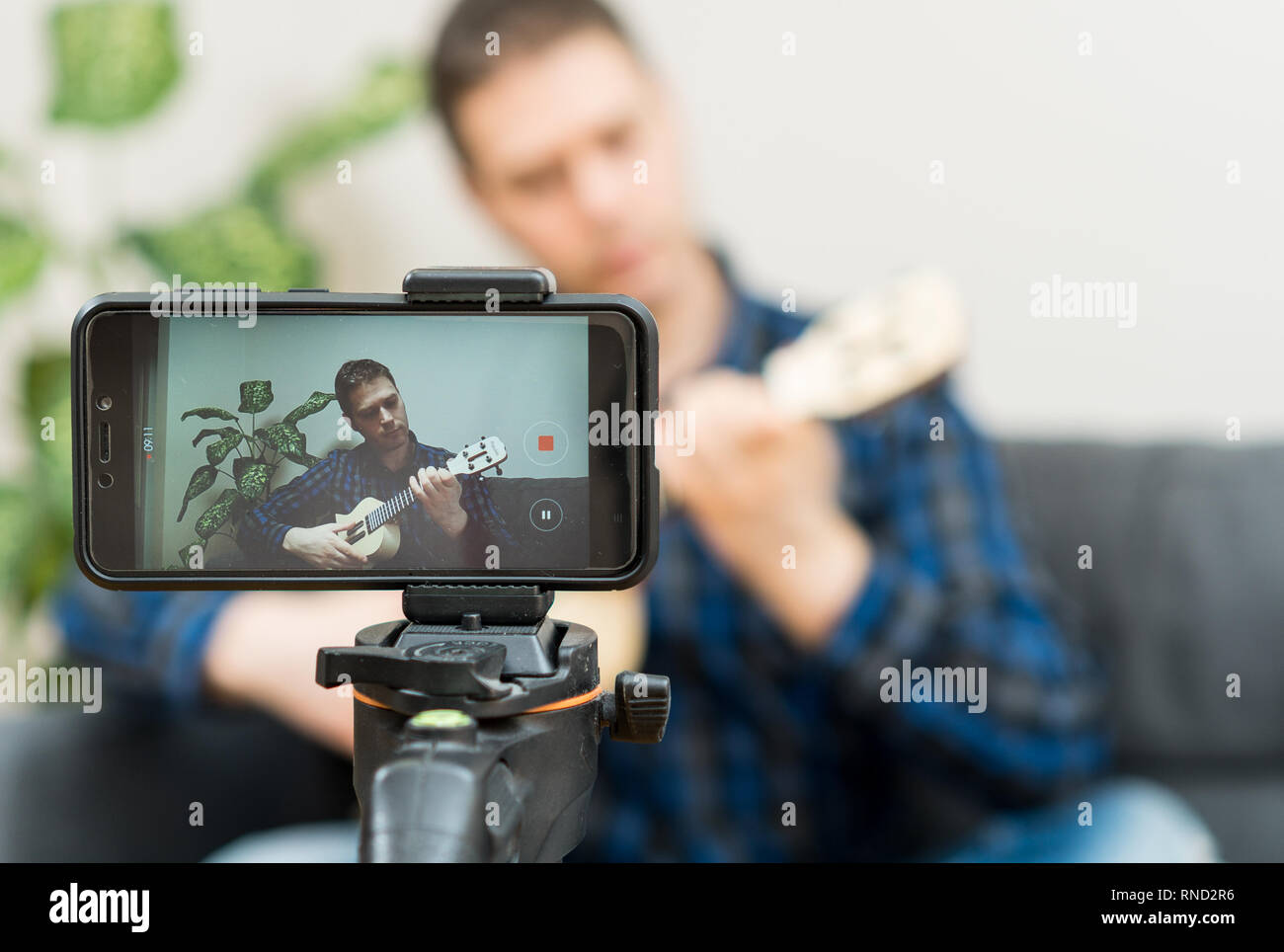 Male guitarist recording song home hi-res stock photography and images ...