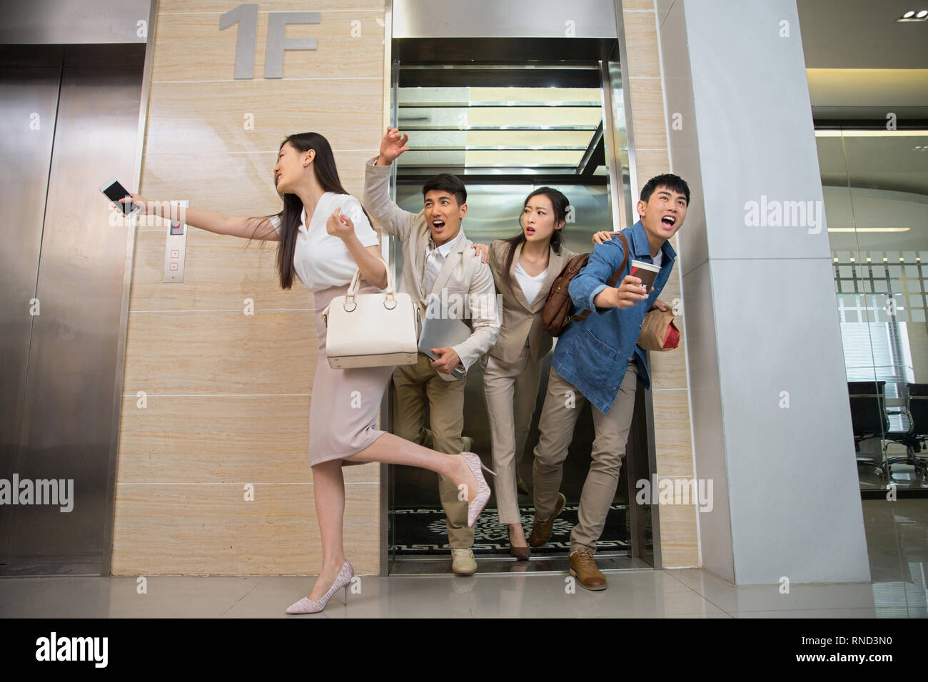 Business men and women crowded elevators Stock Photo - Alamy