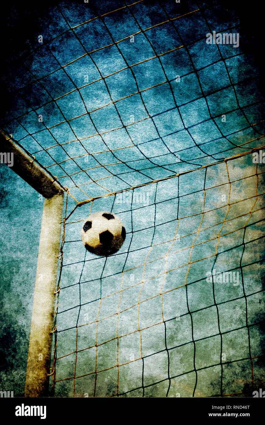ball into the soccer goal, with grunge effect Stock Photo - Alamy