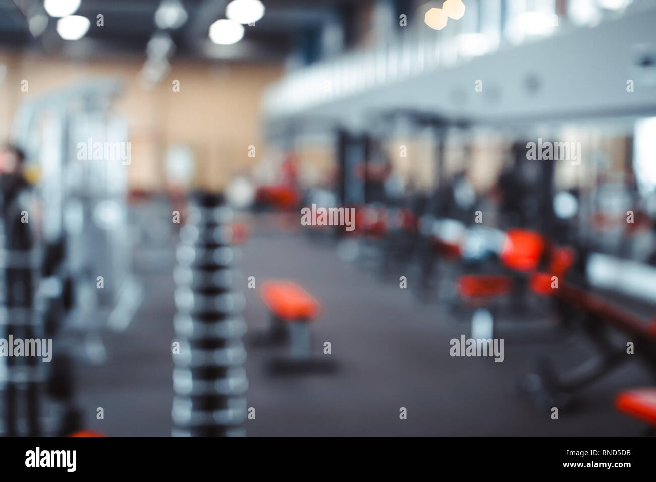 Fitness Gym background.Focus on the Bench and blurred Gym equipment ...