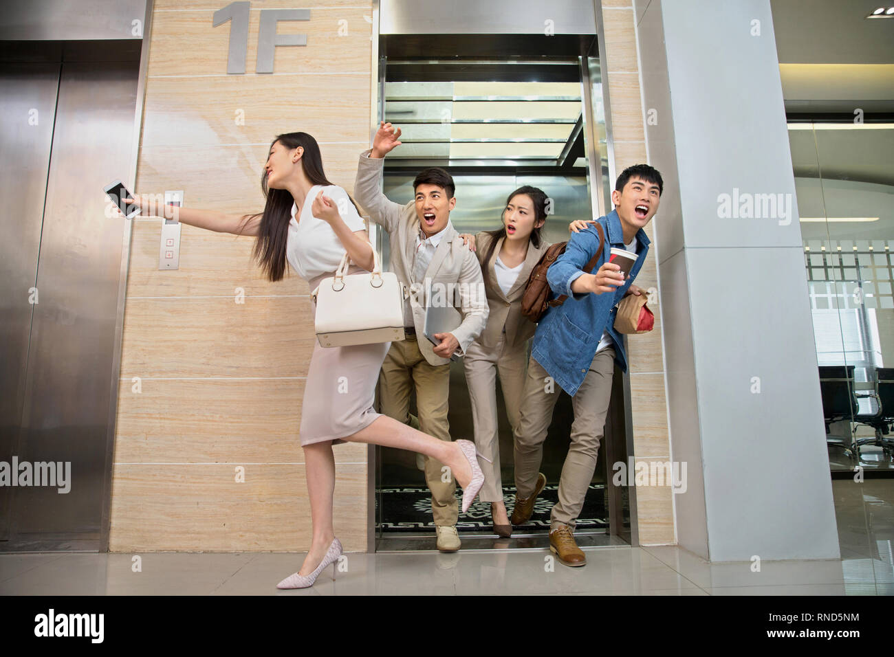 Business men and women crowded elevators Stock Photo - Alamy