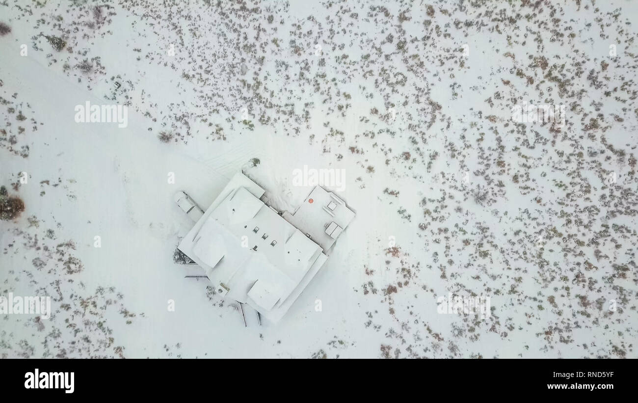 Aerial view of the mountain house covered in snow in the Winter Stock ...