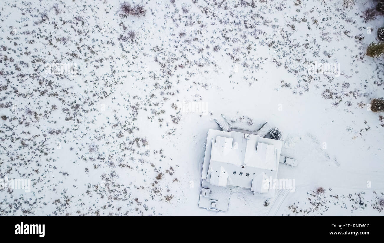 Aerial view of the mountain house covered in snow in the Winter Stock ...