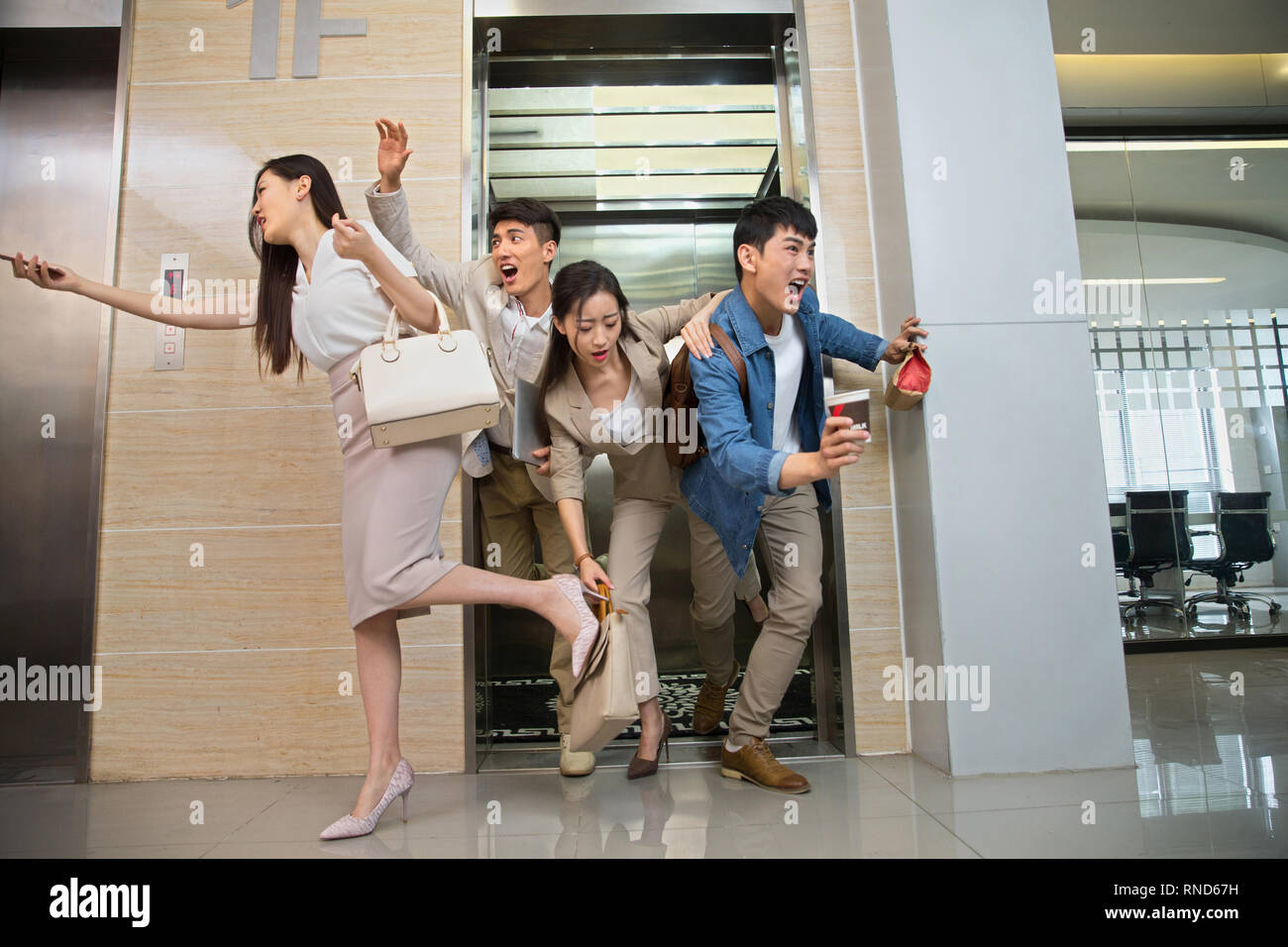 Business men and women crowded elevators Stock Photo - Alamy