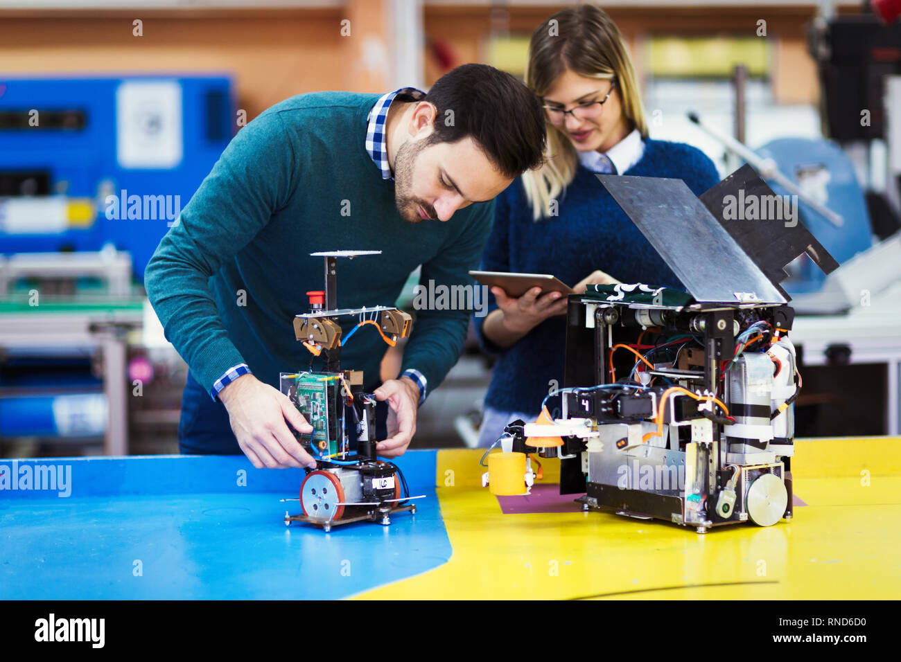 Young students of robotics working on project Stock Photo - Alamy
