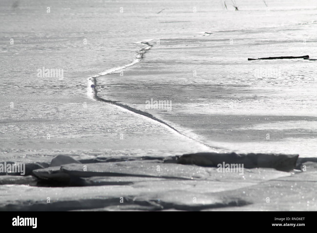 rifts on crystal surface of the frozen sea spring is come Stock Photo ...