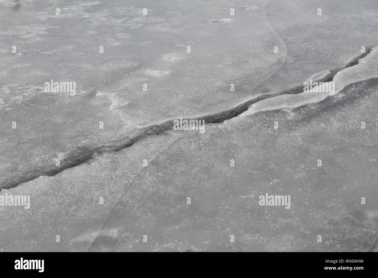 rifts on crystal surface of the frozen sea spring is come Stock Photo ...