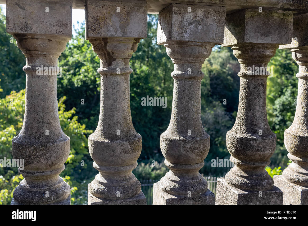 Porch Spindles in garden veranda Stock Photo - Alamy