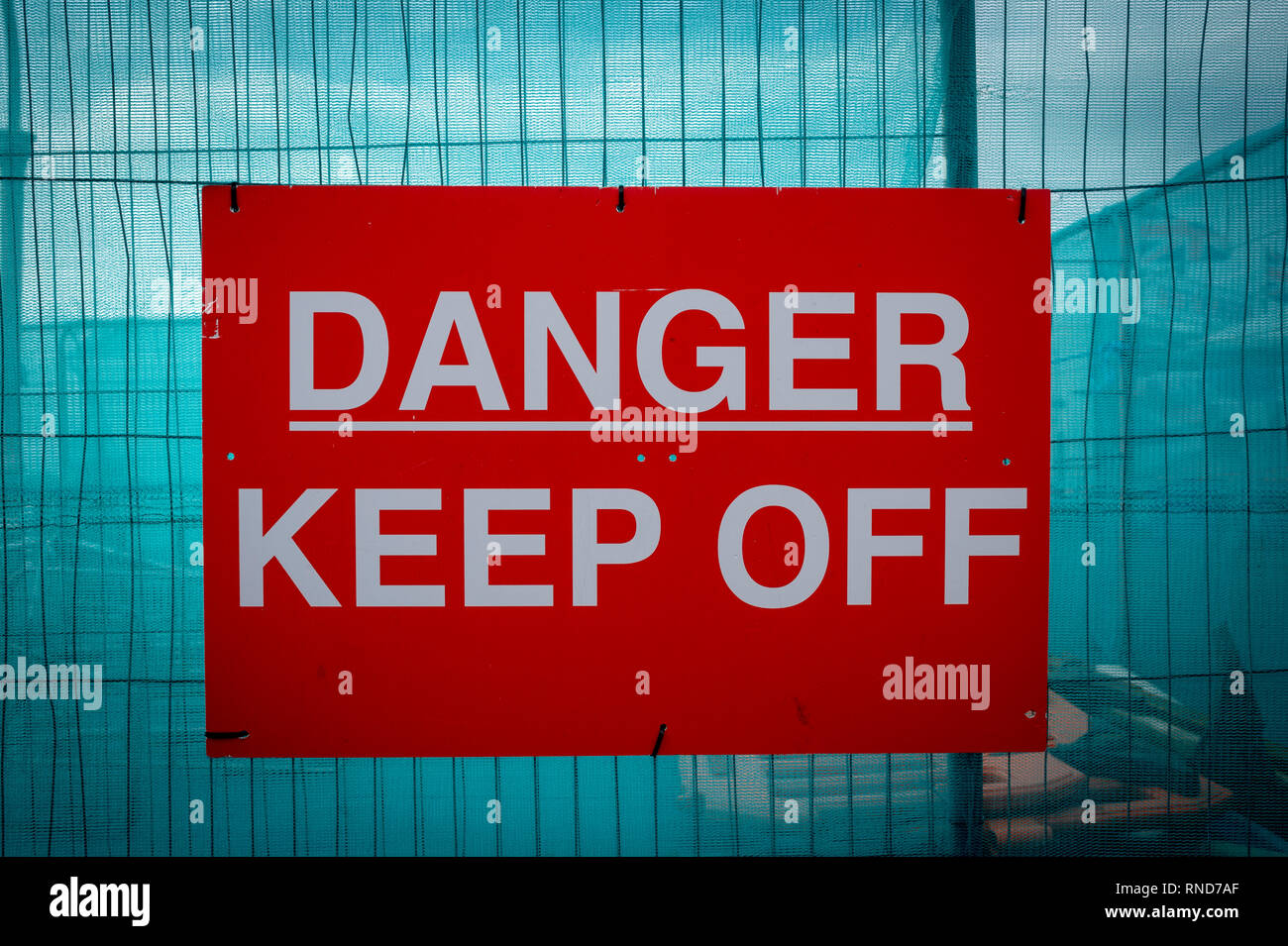 Danger keep off sign on a fence Stock Photo - Alamy