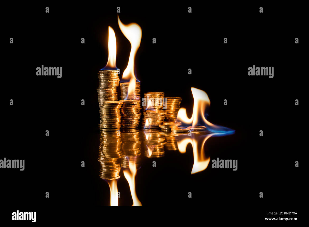 Euro coin with fire flames Stock Photo - Alamy
