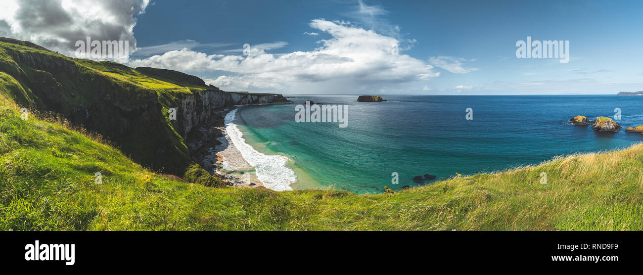 Panoramic view of the Northern Ireland shoreline. Cozy bay surrounded ...