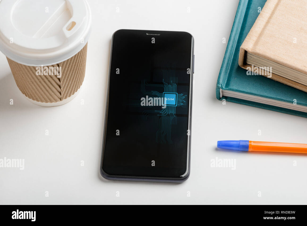 Modern phone with embedded SIM Stock Photo - Alamy