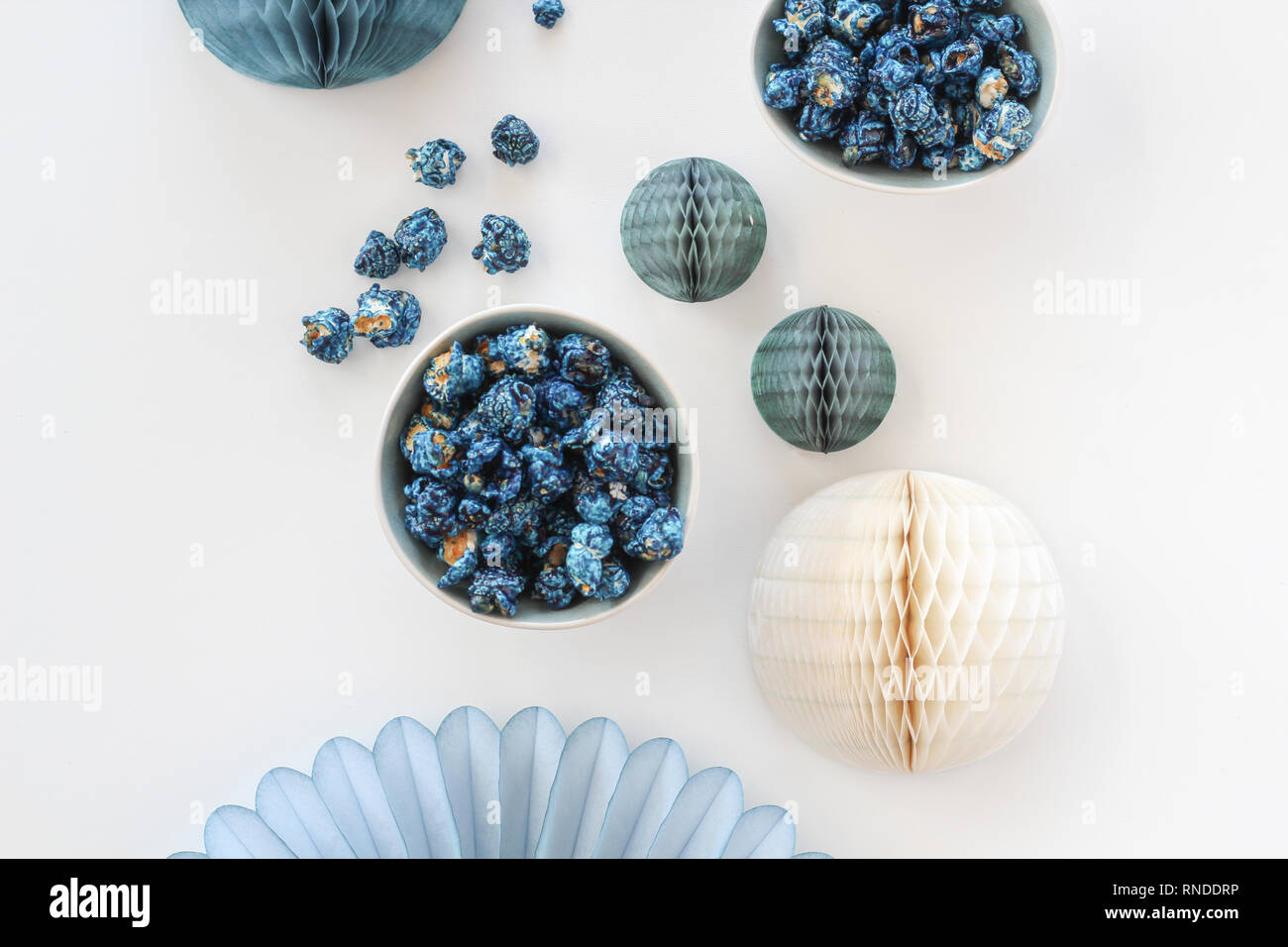 Blueberry popcorn on bowls and blue paper decorations Stock Photo - Alamy